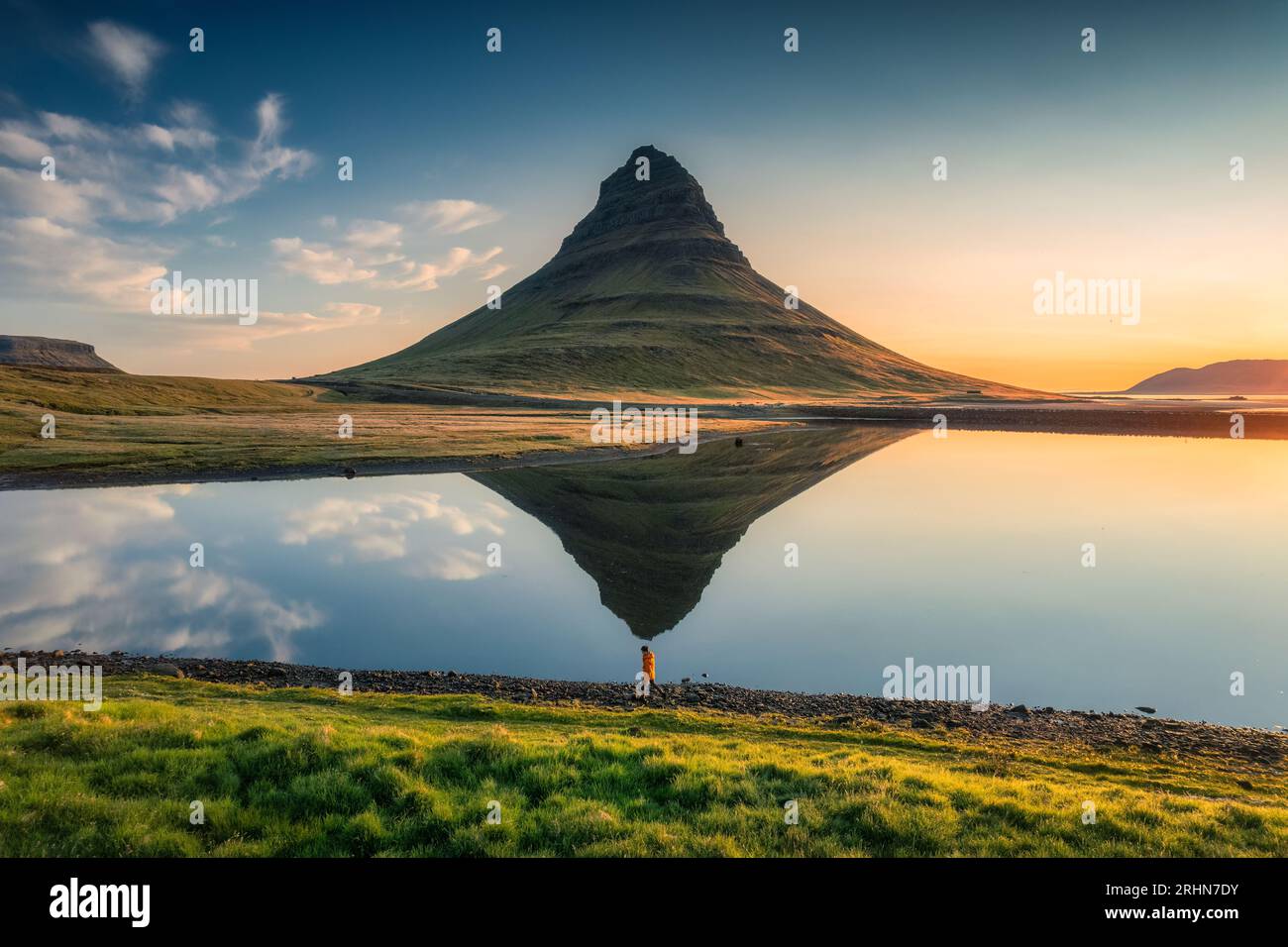 Aerial view of majestic symmetry volcano Kirkjufell mountain with lake ...