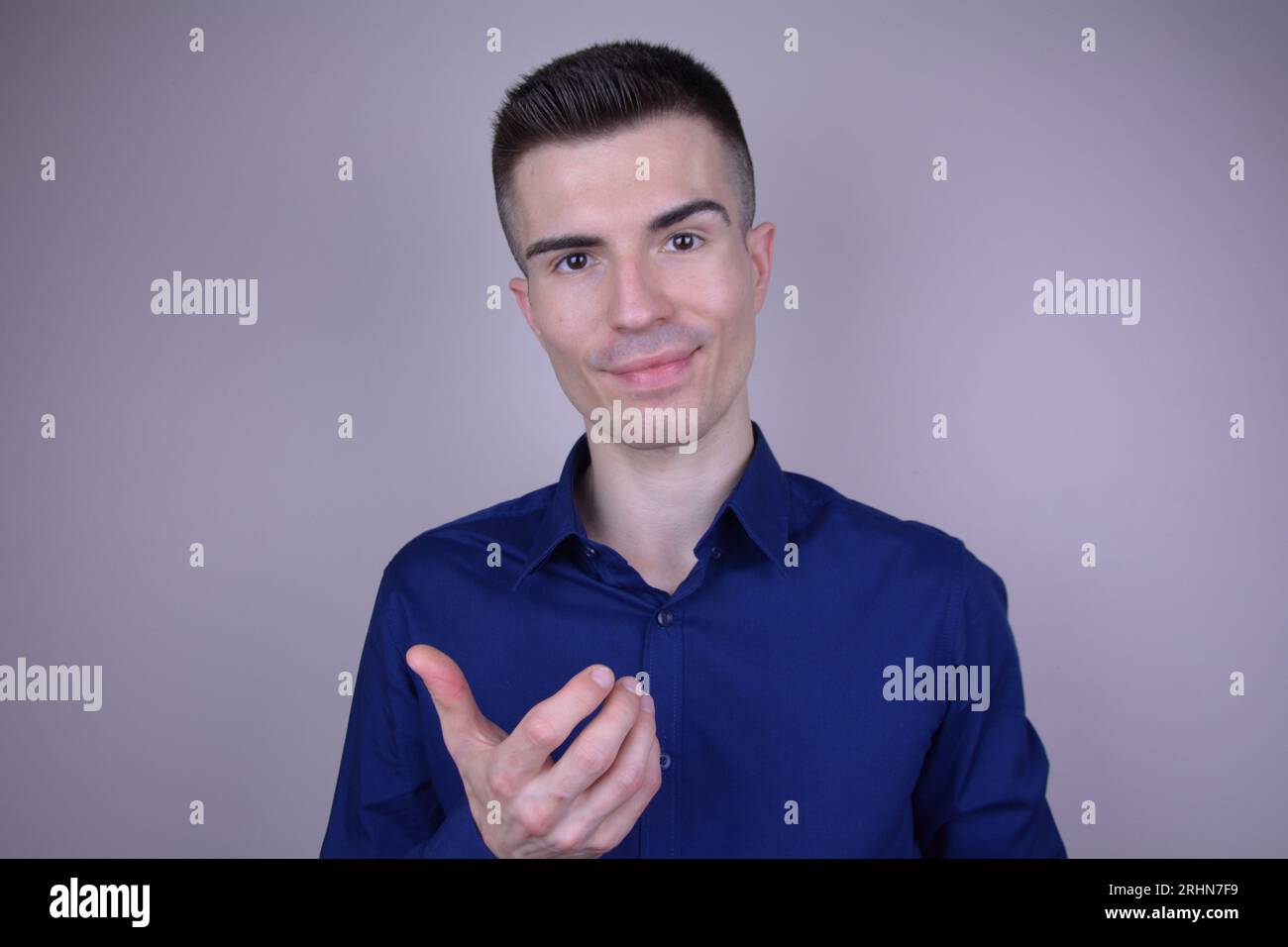 Elegant and Handsome Young Caucasian Man Holding Invisible Object on ...