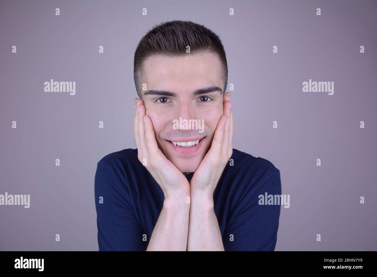 Smiling Handsome Caucasian Man Cheerfully Holds Both Hands on Cheeks ...