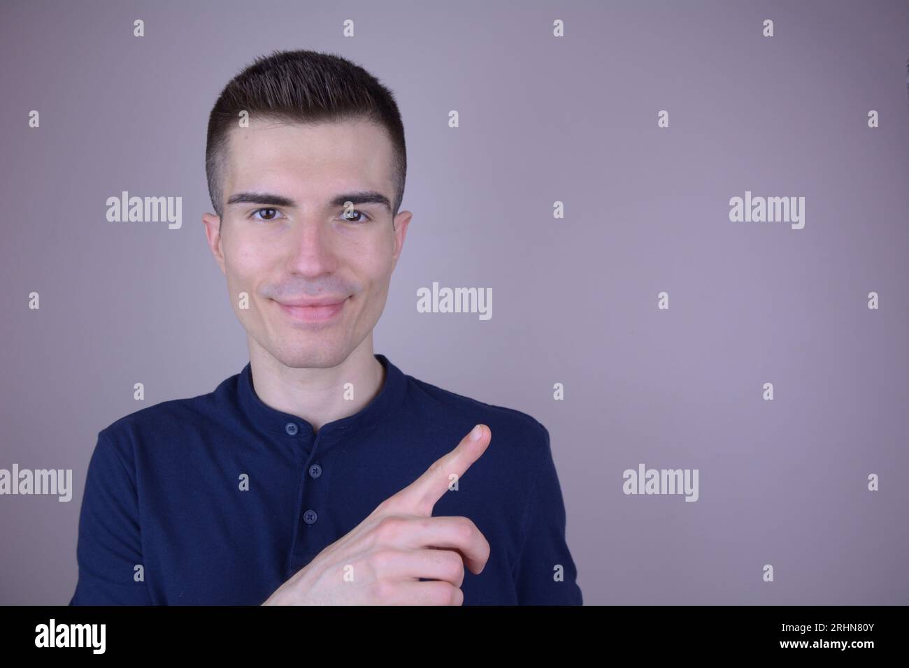 Young man points hi-res stock photography and images - Alamy