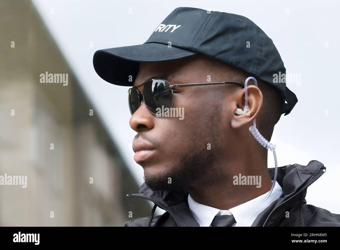 Portrait Of Young African Male Security Guard Standing Arms Crossed ...