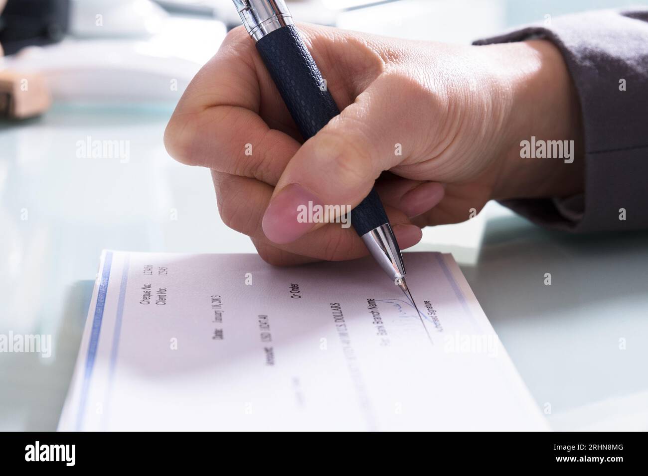 Signing cheques hi-res stock photography and images - Alamy
