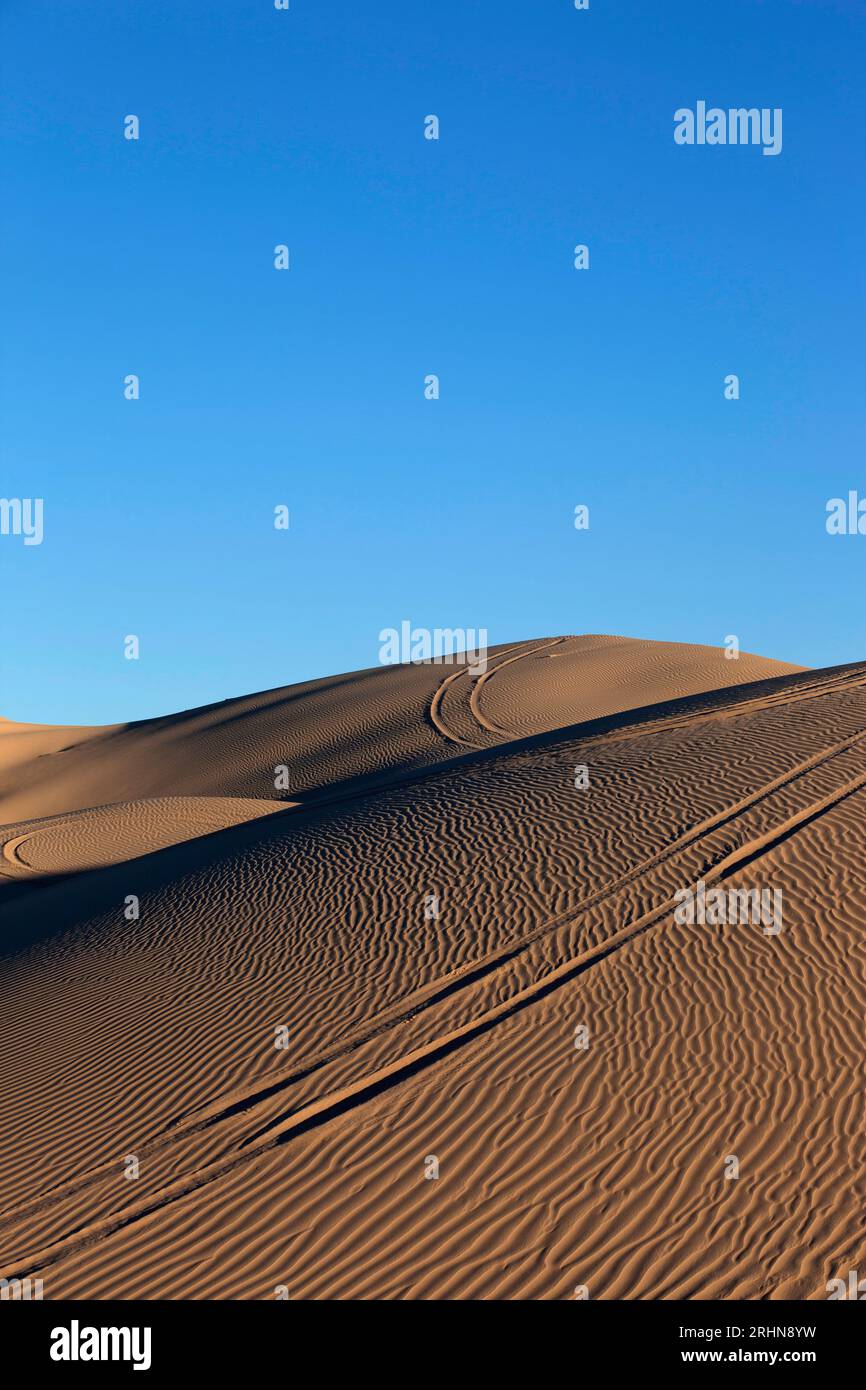 San dunes with wheel ruts and patterns vertical Stock Photo - Alamy
