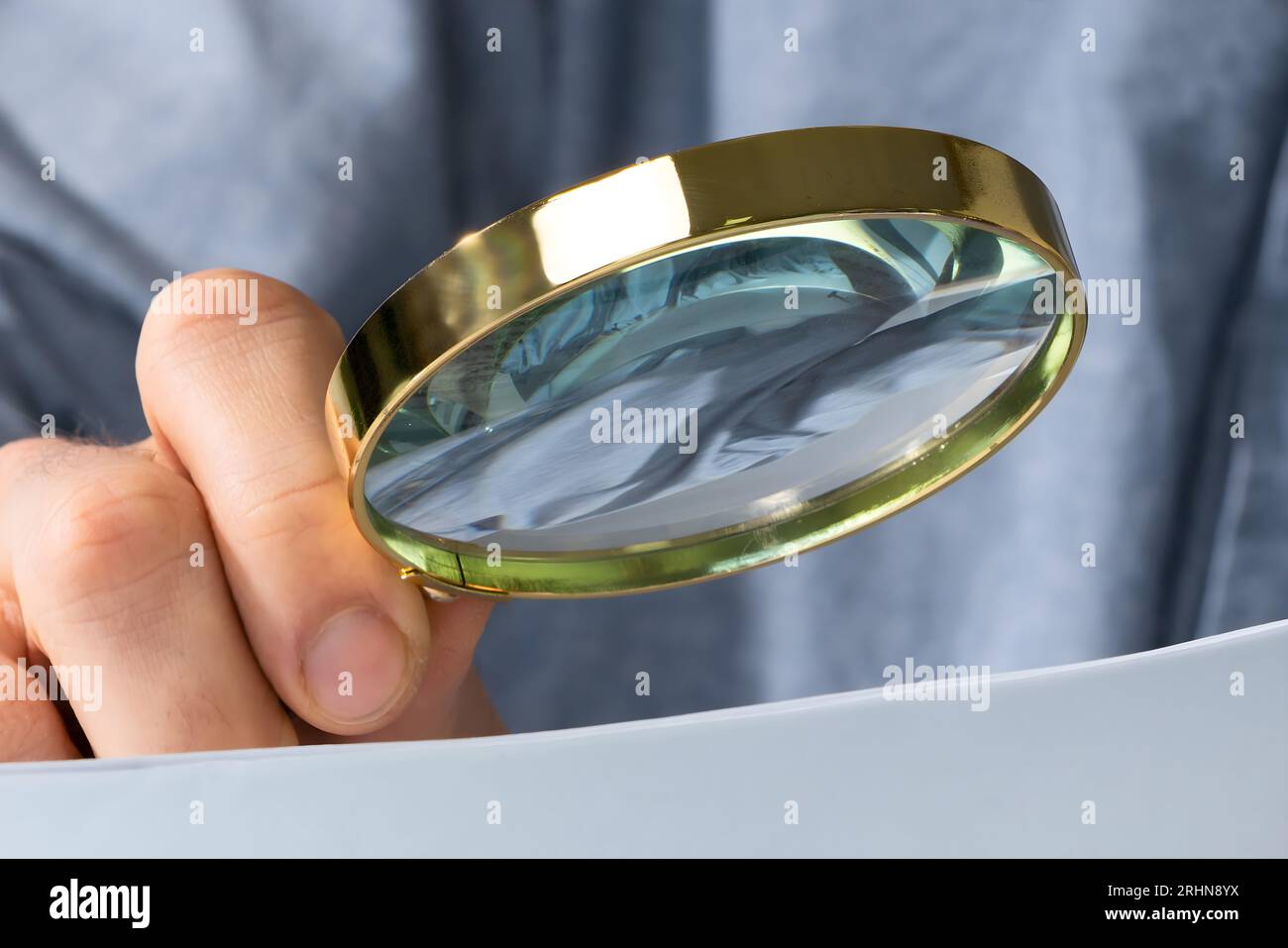 Businessman Looking At Document Through Magnifying Glass Stock Photo ...