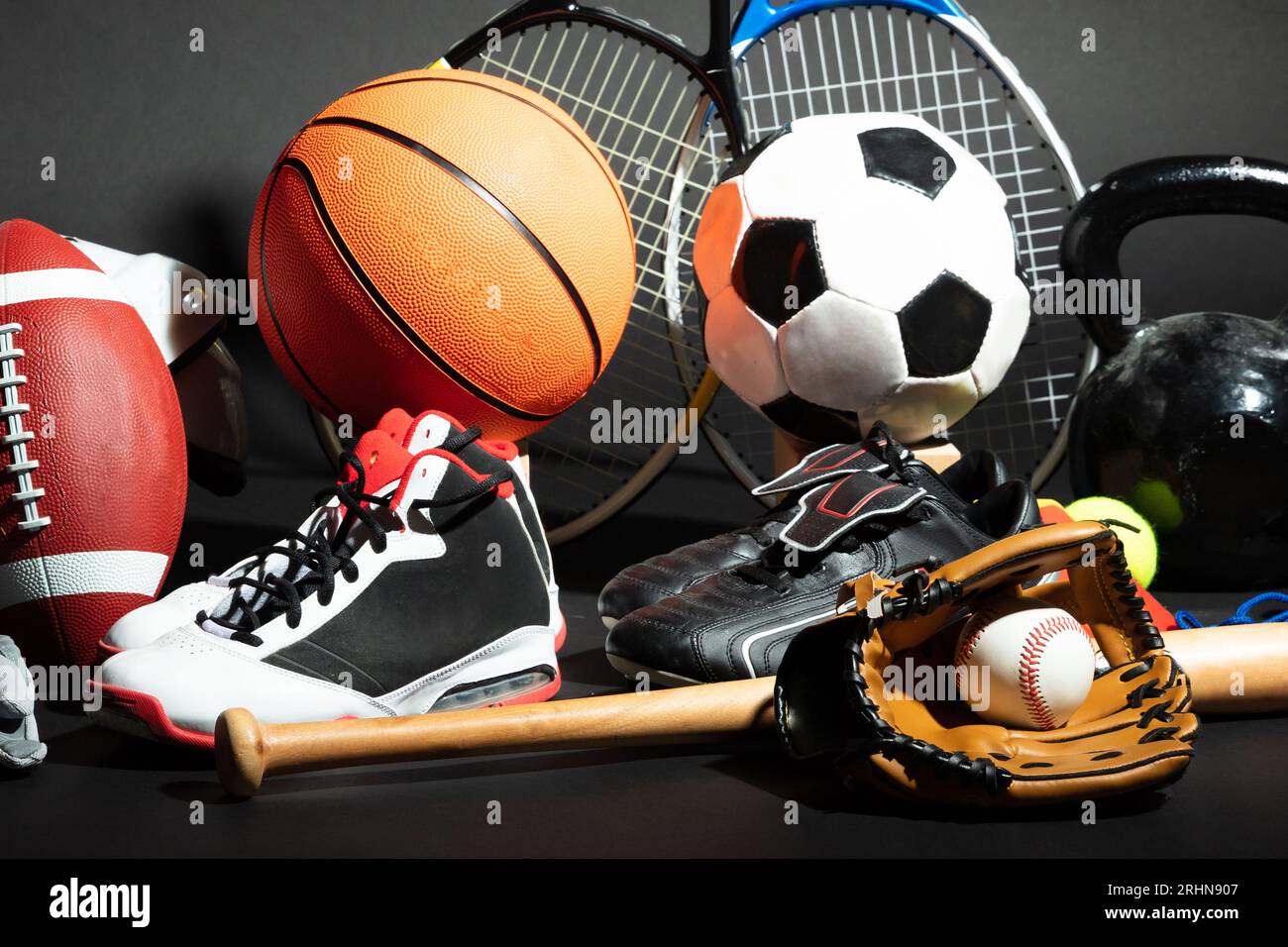 Variety Of Sport Balls And Equipment In Front Of Black Surface Stock ...