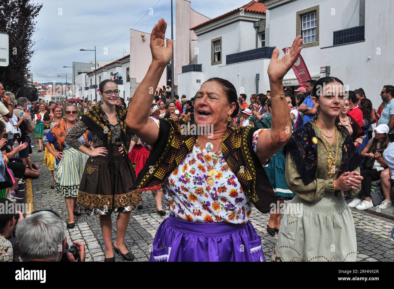 Women present jewelry and traditional costumes at Mordomia Parade, one ...