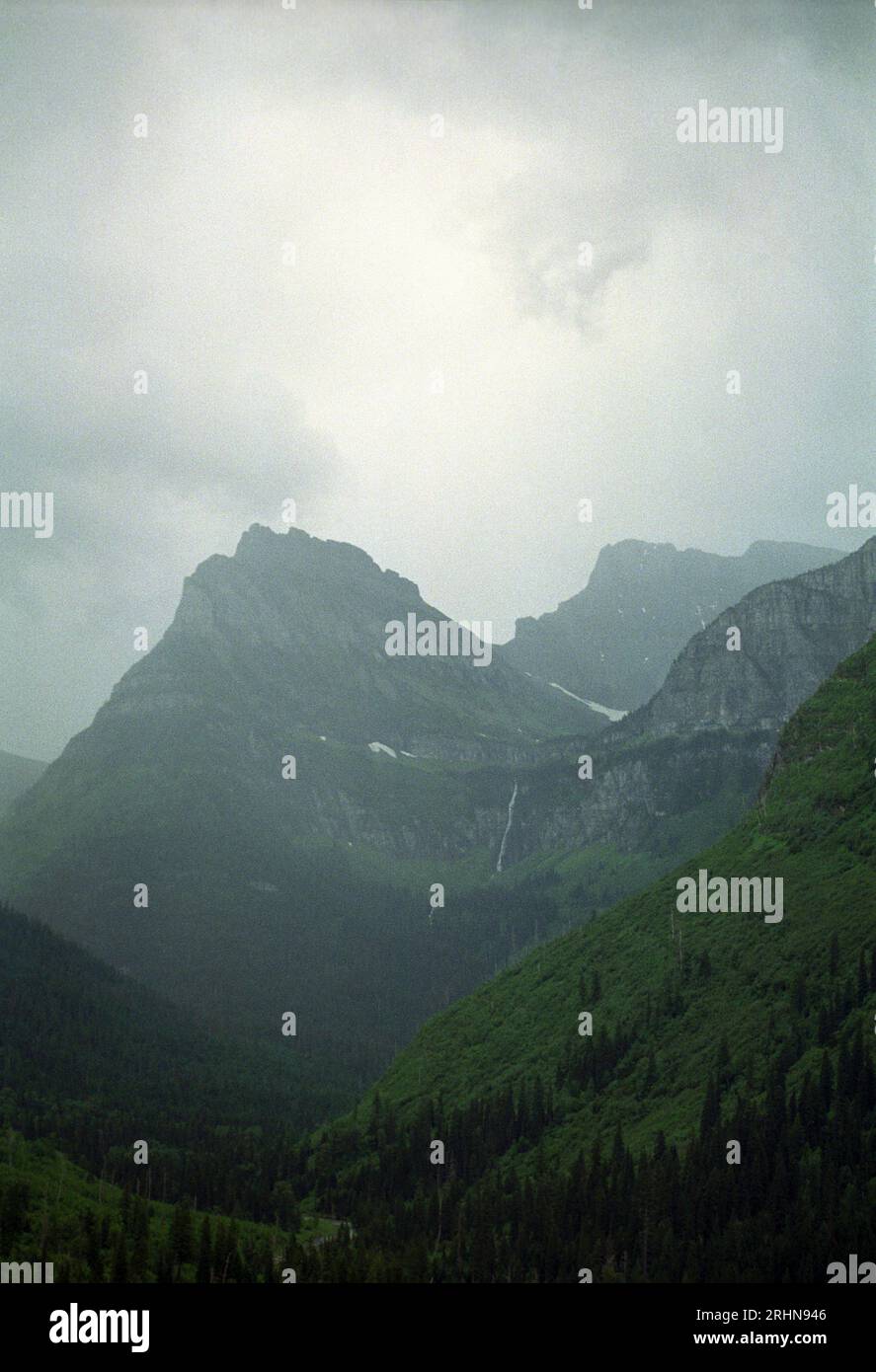 Vertical film photo of mountains in rain Stock Photo - Alamy
