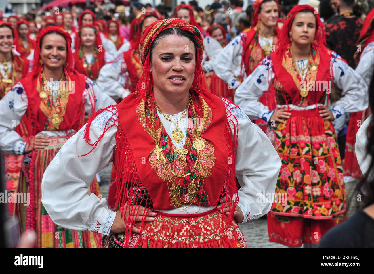 Women present jewelry and traditional costumes at Mordomia Parade, one ...