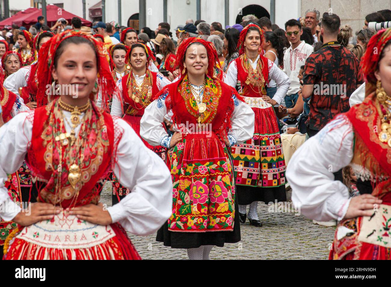 Women present jewelry and traditional costumes at Mordomia Parade, one ...