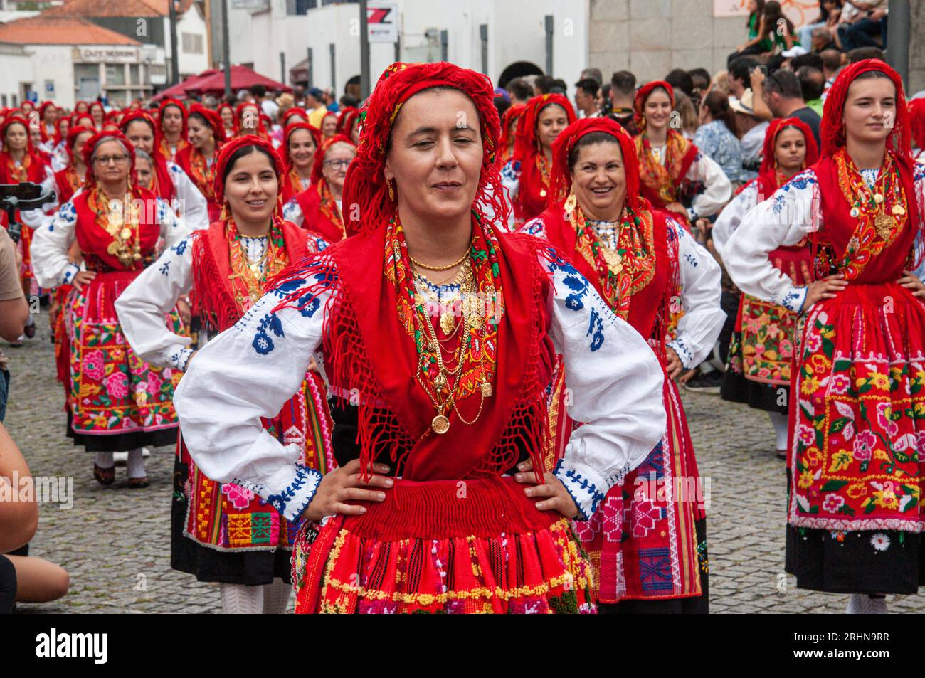 Women present jewelry and traditional costumes at Mordomia Parade, one ...