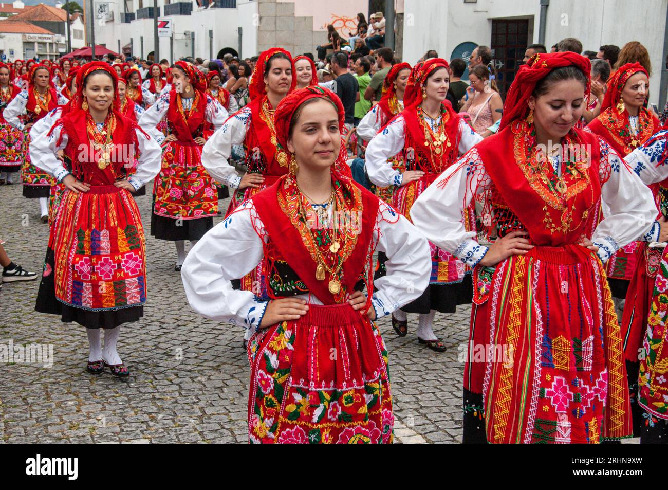 Women present jewelry and traditional costumes at Mordomia Parade, one ...