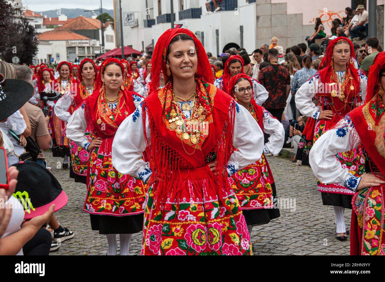 Women present jewelry and traditional costumes at Mordomia Parade, one ...