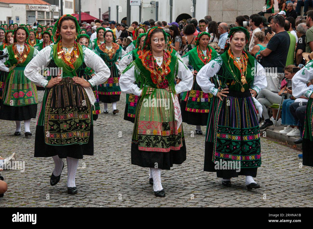 Women present jewelry and traditional costumes at Mordomia Parade, one ...