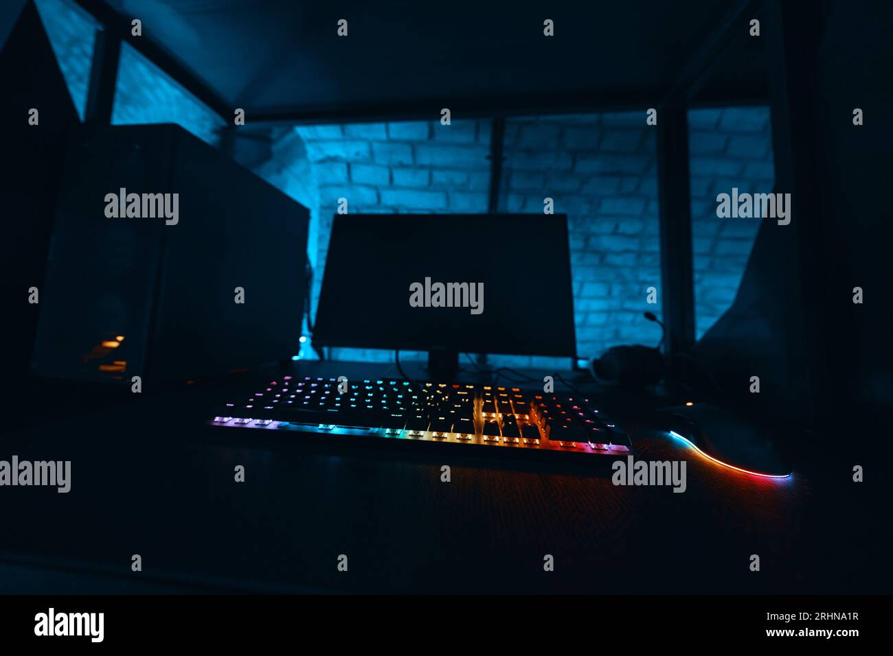 Gaming computer in a dark neon room Stock Photo - Alamy