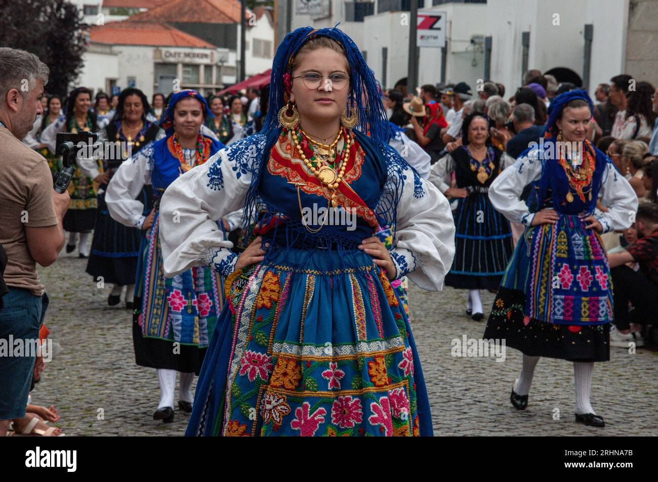 Women present jewelry and traditional costumes at Mordomia Parade, one ...