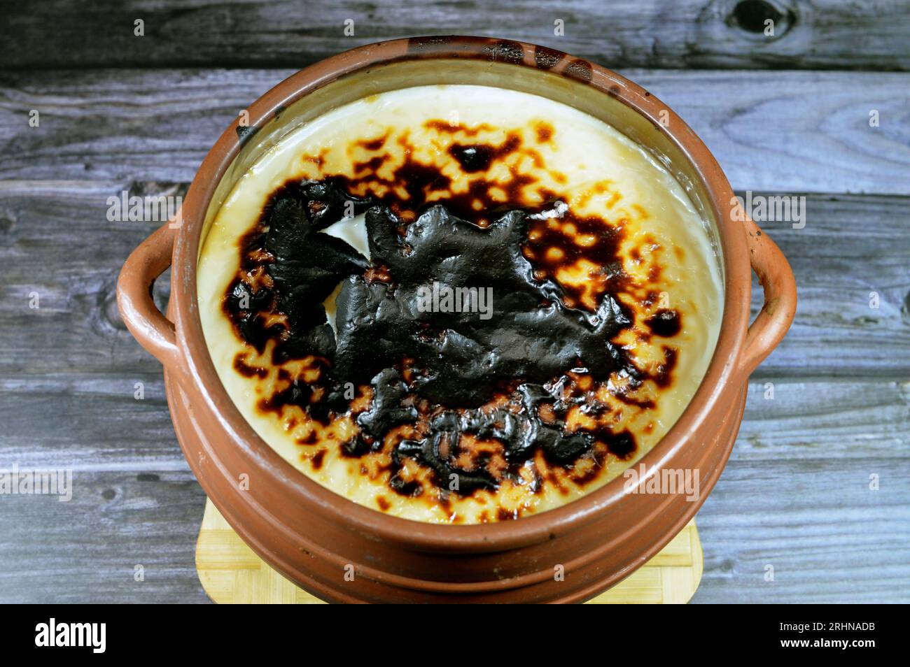 Rice pudding pottery casserole over baked burnt in the oven, rice, corn ...