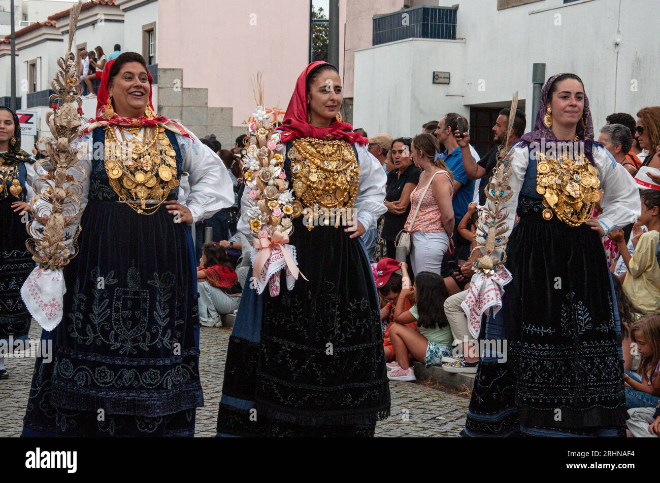 Women present jewelry and traditional costumes at Mordomia Parade, one ...