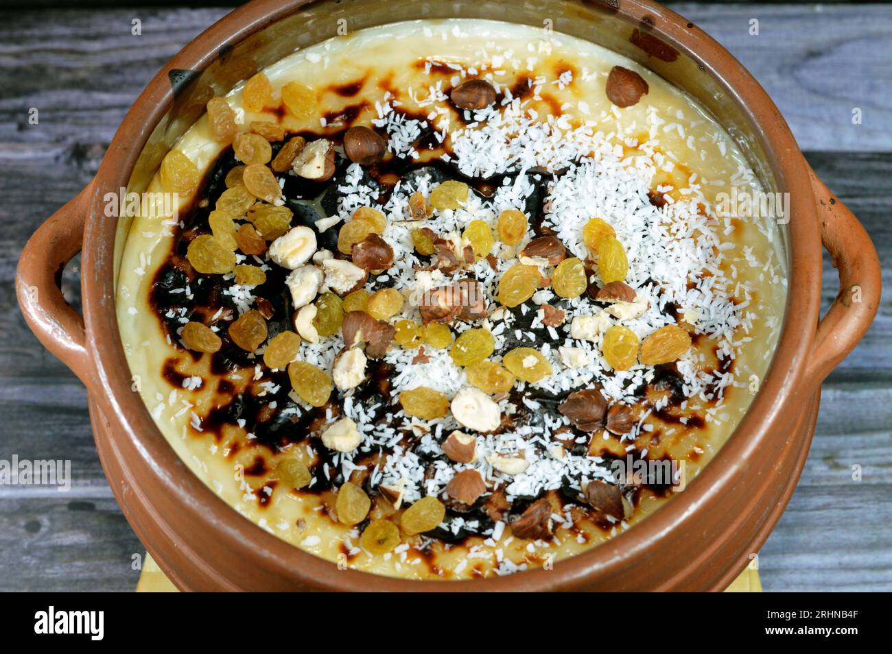 Rice pudding pottery casserole over baked burnt in the oven, rice, corn ...