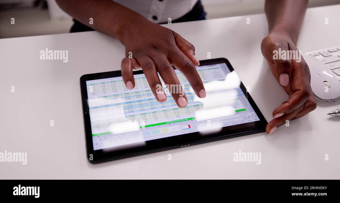 African American Spreadsheet Data Analyst Using Computer Software Stock ...