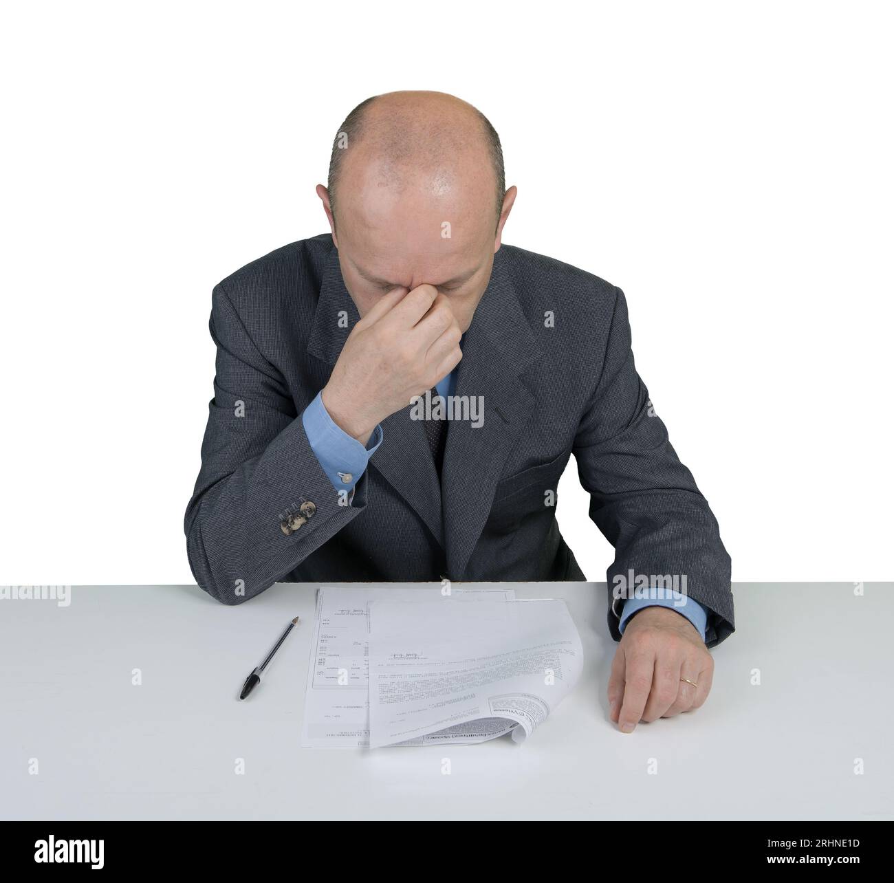 a desperate businessman in front of a contract to be signed on a ...