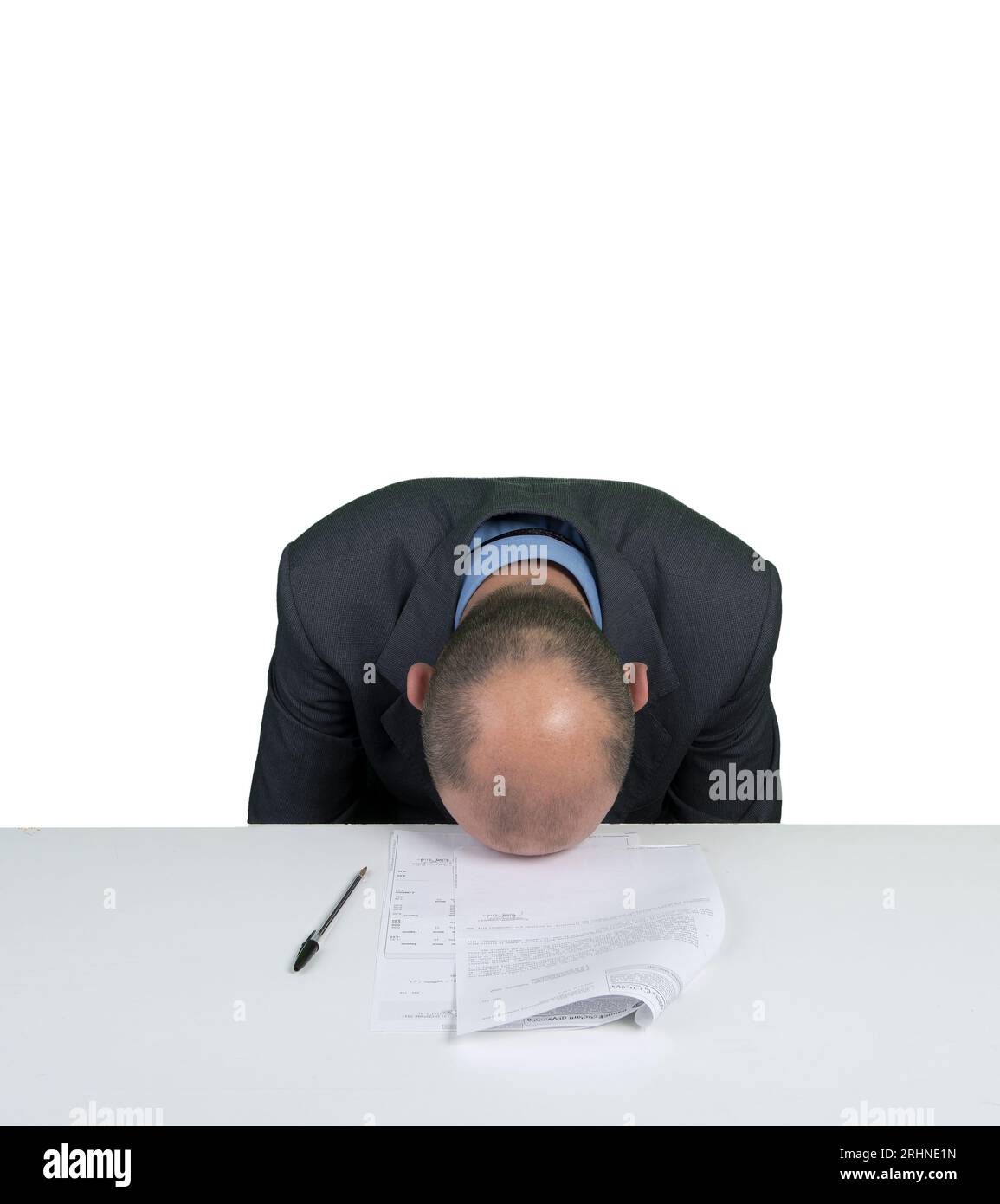 a desperate businessman in front of a contract to be signed on a ...