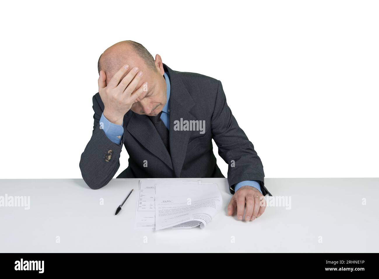 a desperate businessman in front of a contract to be signed on a ...