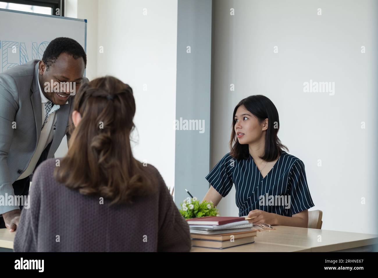 Positive friendly African American English tutor giving language ...