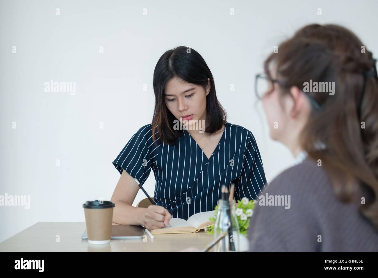 Group Asian Student Smile and reading a book for students discussing ...