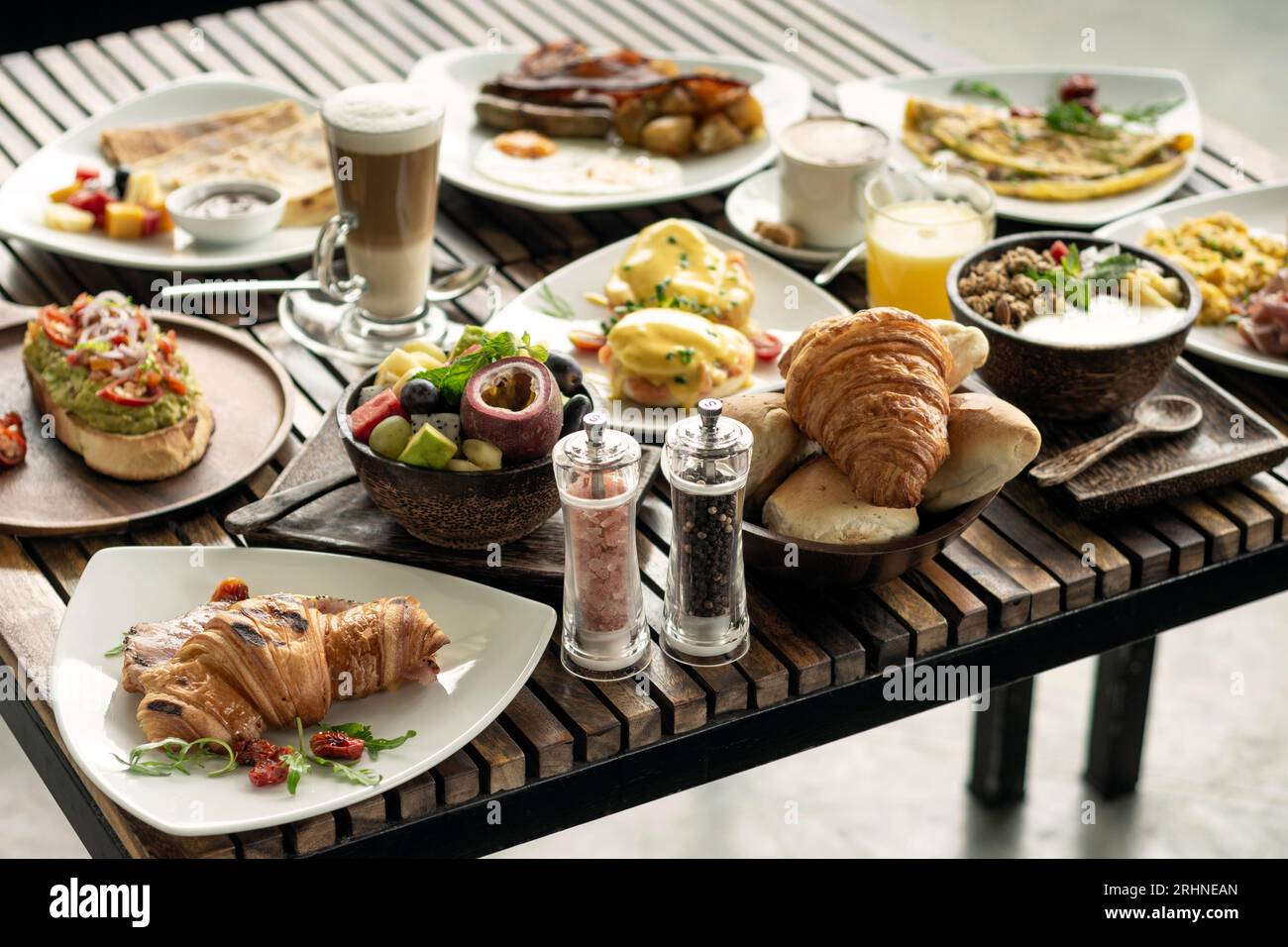 many mixed western breakfast food items on cafe table Stock Photo - Alamy