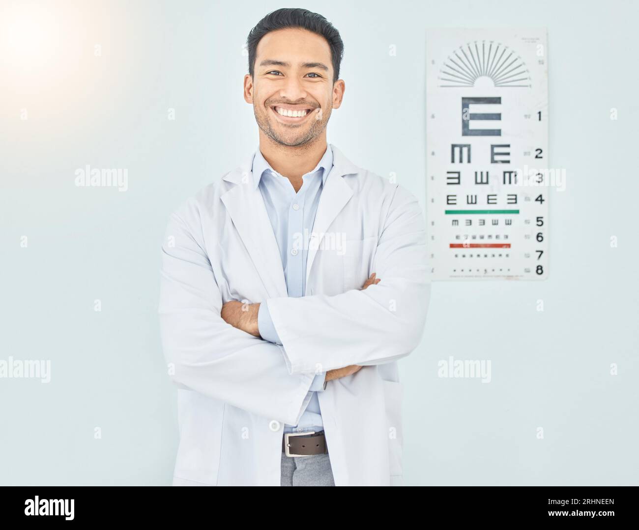 Ophthalmologist, portrait and man with arms crossed in hospital mockup ...