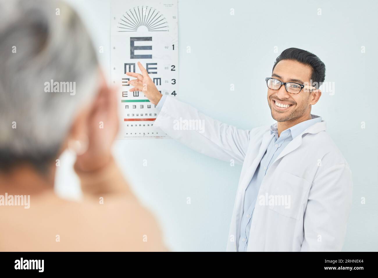 Vision, test for eyes and reading chart, optometrist and patient ...