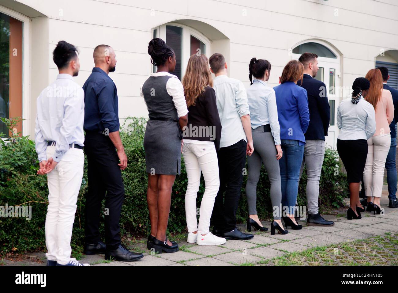 Queue Outdoors. Business People Waiting In Line Stock Photo - Alamy