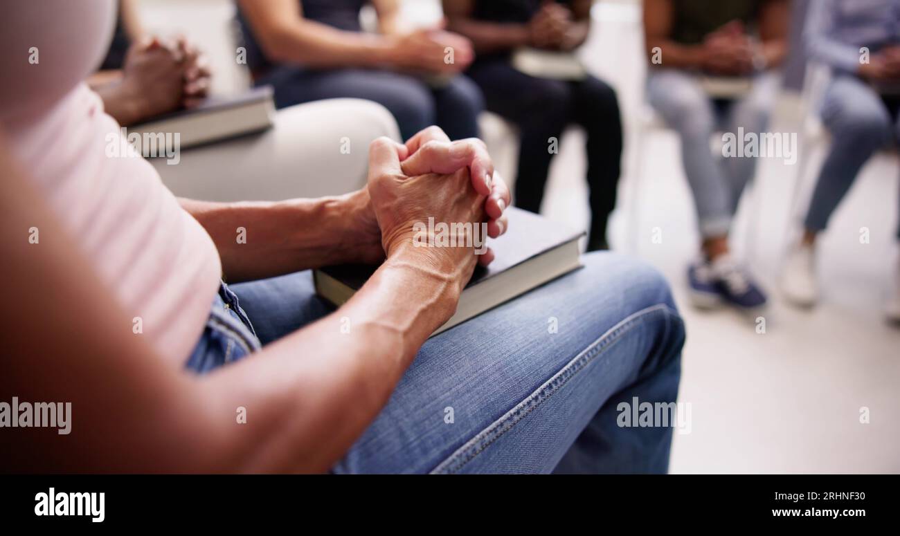 Christian Group Praying To Jesus With Bible Stock Photo - Alamy