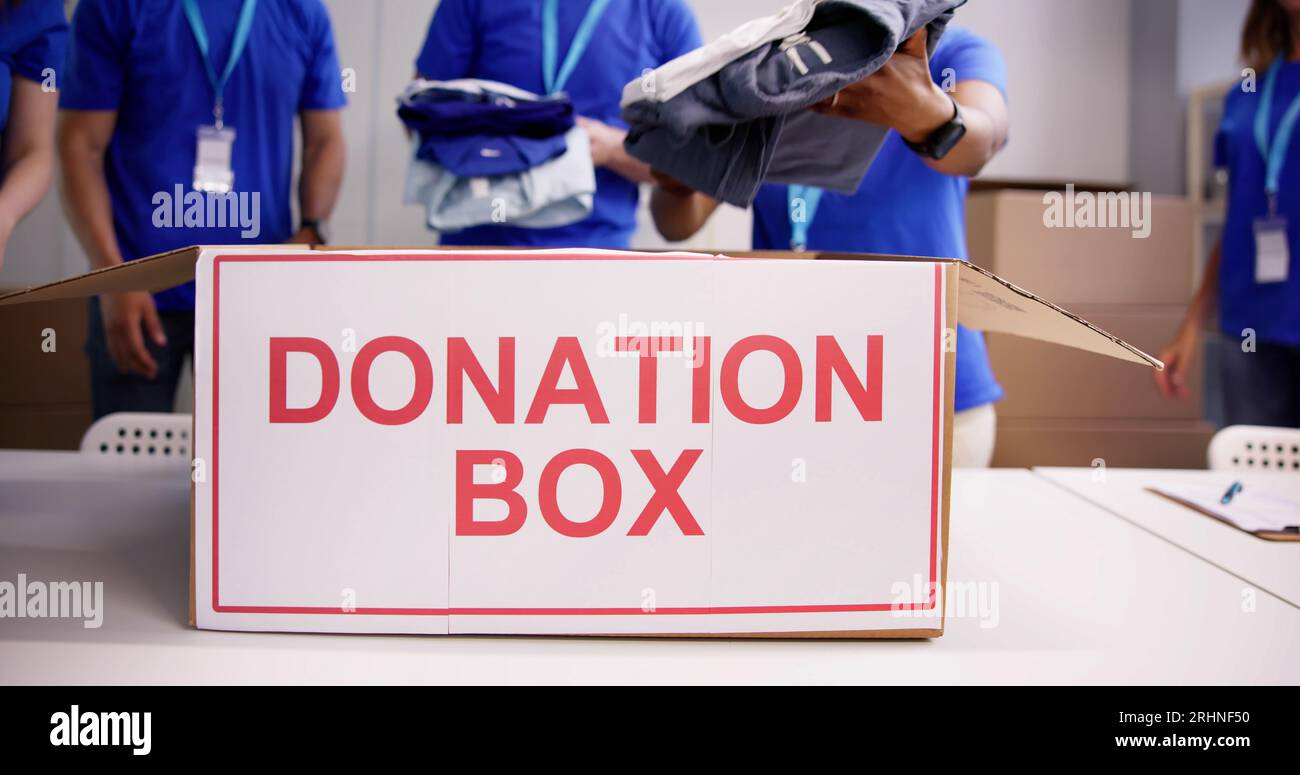 Clothes Charity Team Help. Volunteer Community Support Stock Photo - Alamy