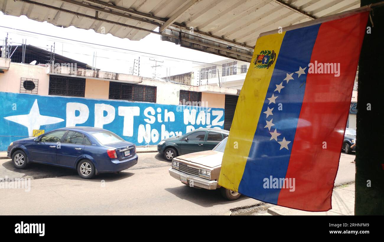 A picture depicting the flag of Venezuela alongside a political slogan ...