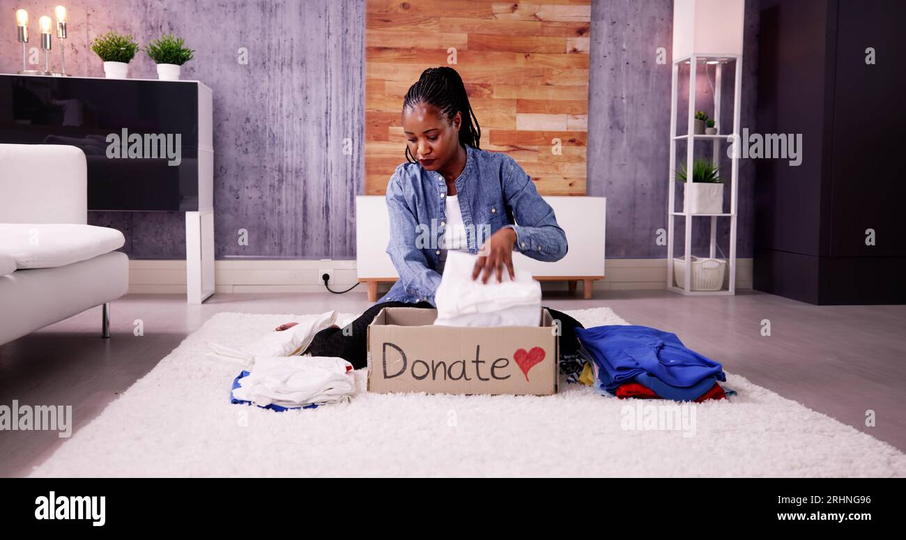 Donating Decluttering And Cleaning Up Wardrobe Clothes Stock Photo - Alamy