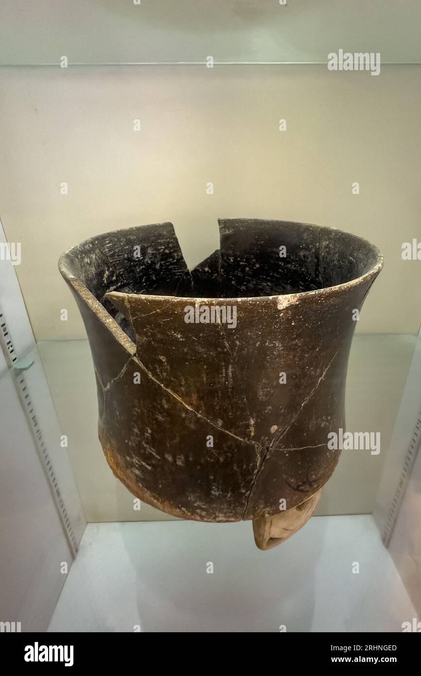 A Mayan ceramic pot in the visitors center museum in the Cahal Pech ...