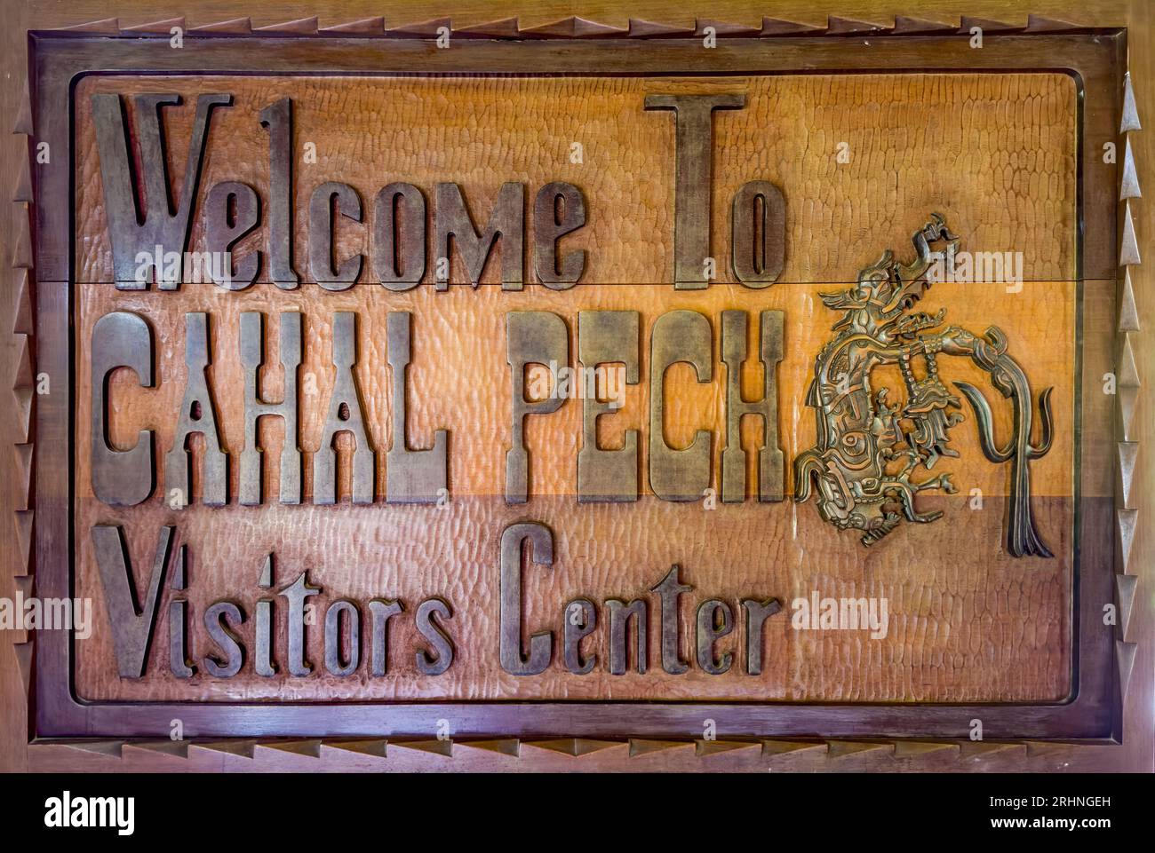 Carved wooden welcome sign for the Visitors Center in the Cahal Pech ...