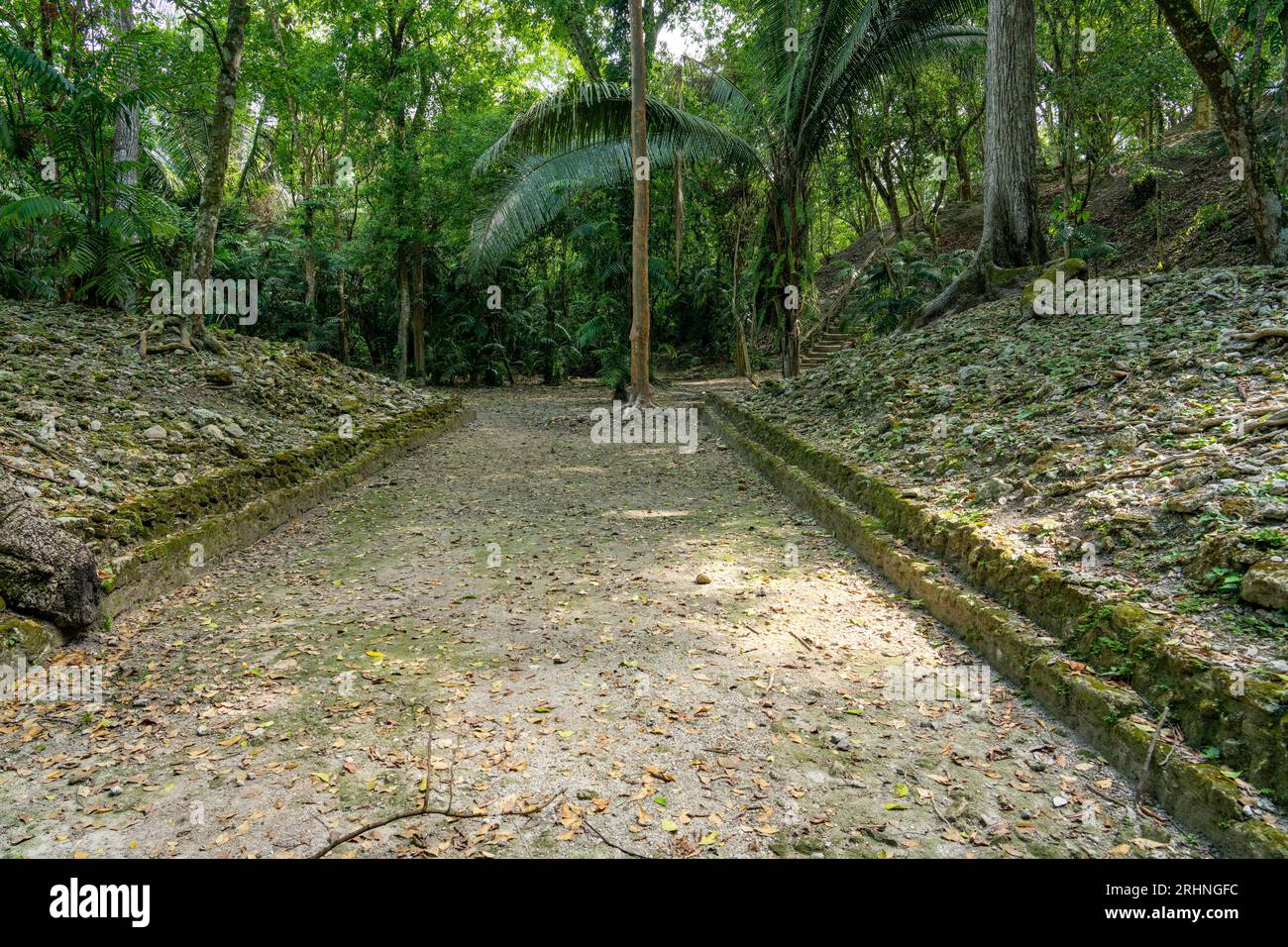 The partially-restored West Ball Court in the Mayan ruins in the Cahal ...