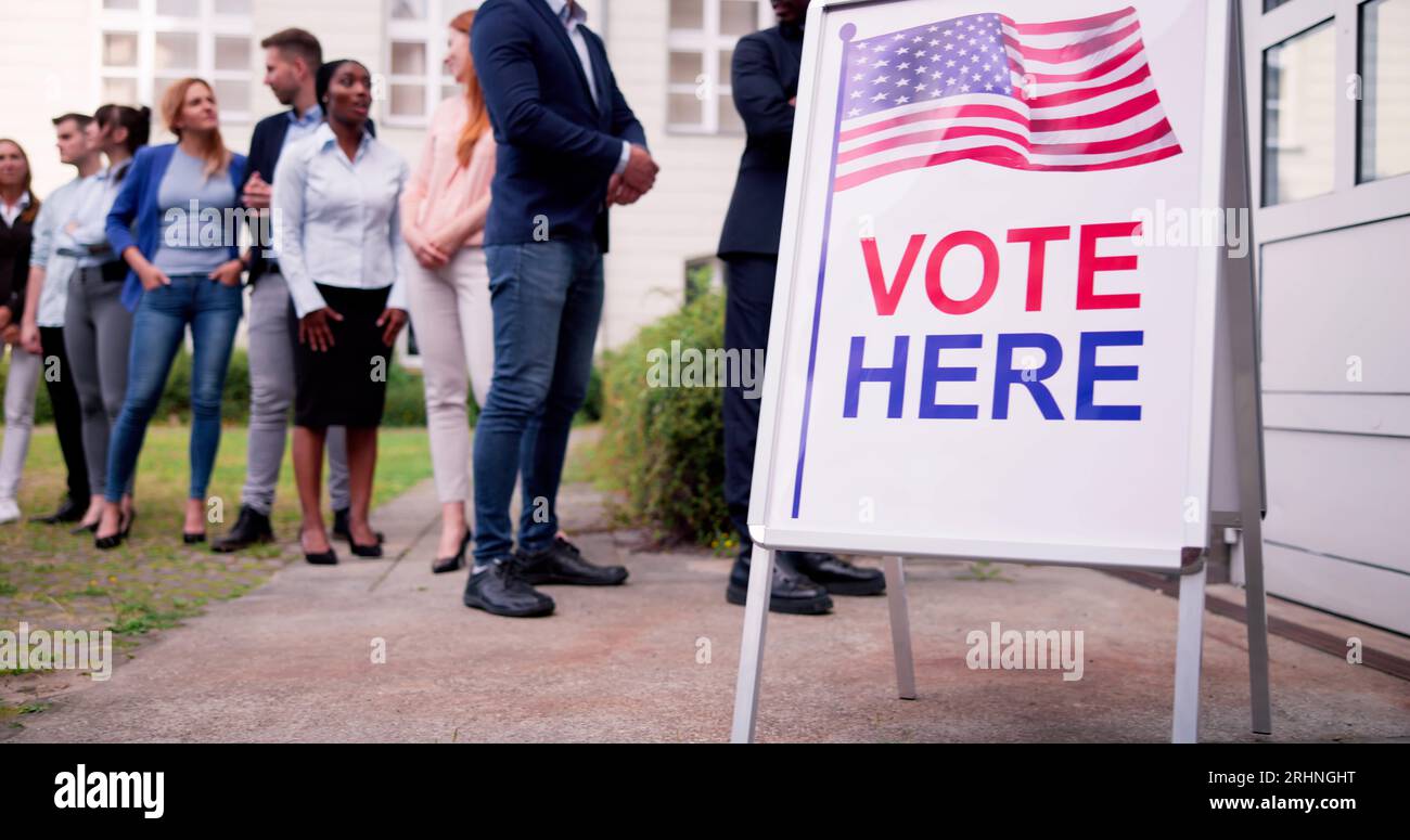 Diverse People At Voting Booth. Vote Here Elections Sign Stock Photo ...