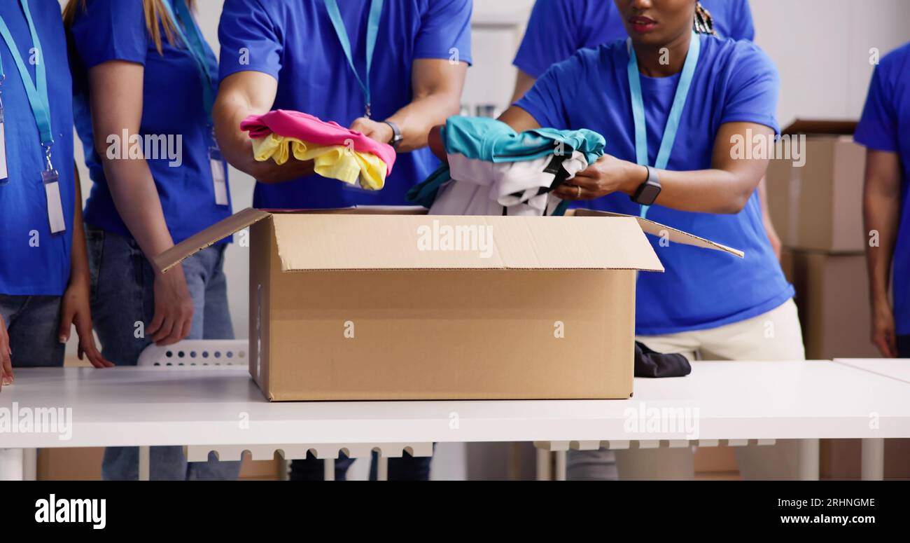 Clothes Charity Team Help. Volunteer Community Support Stock Photo - Alamy