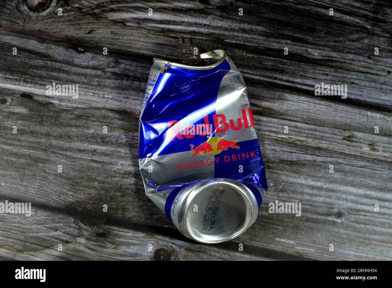 Cairo, Egypt, July 28 2023: Crushed dented Red Bull energy drink, a ...