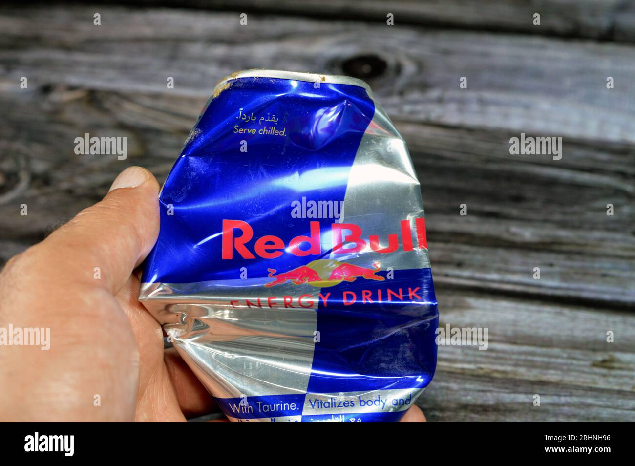 Cairo, Egypt, July 28 2023: Crushed dented Red Bull energy drink, a ...