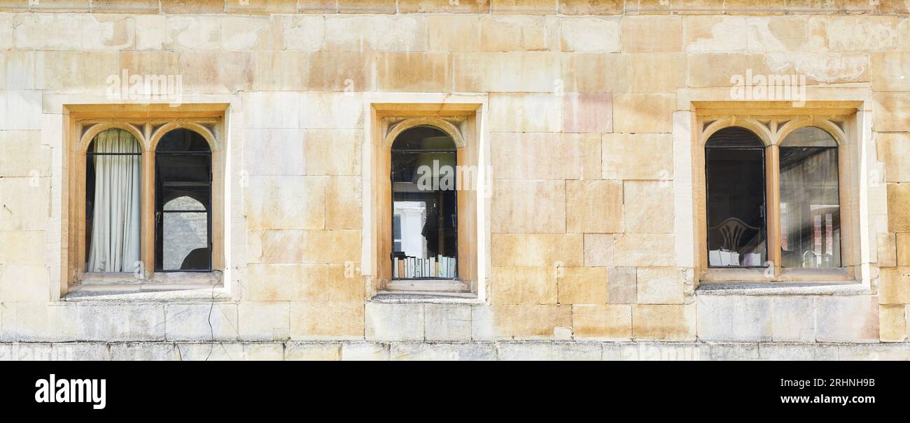 A trio of windows on a stone wall at Pembroke College, founded in the ...