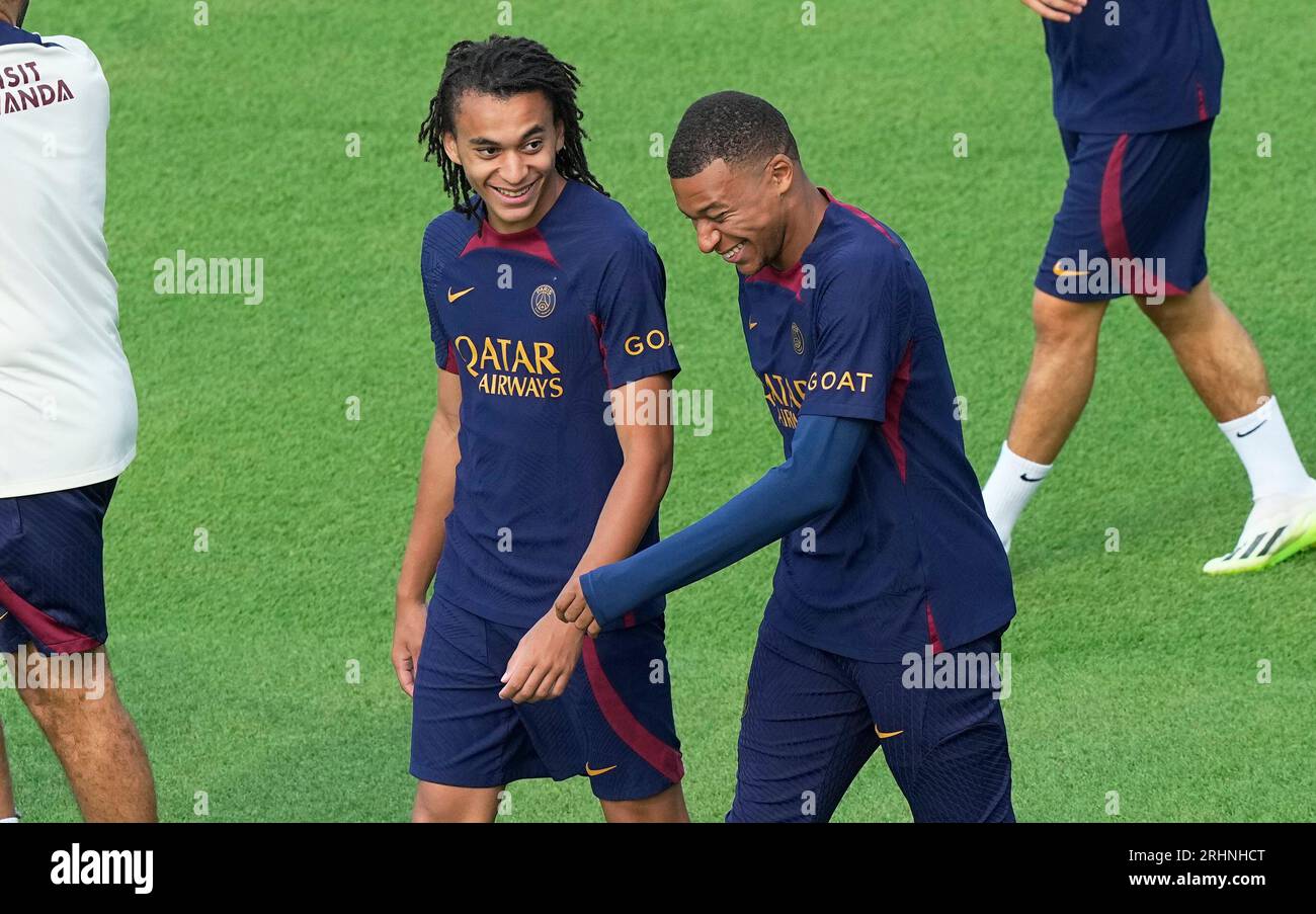 PSG's Kylian Mbappe, right, talks to his brother PSG's Ethan Mbappe as ...