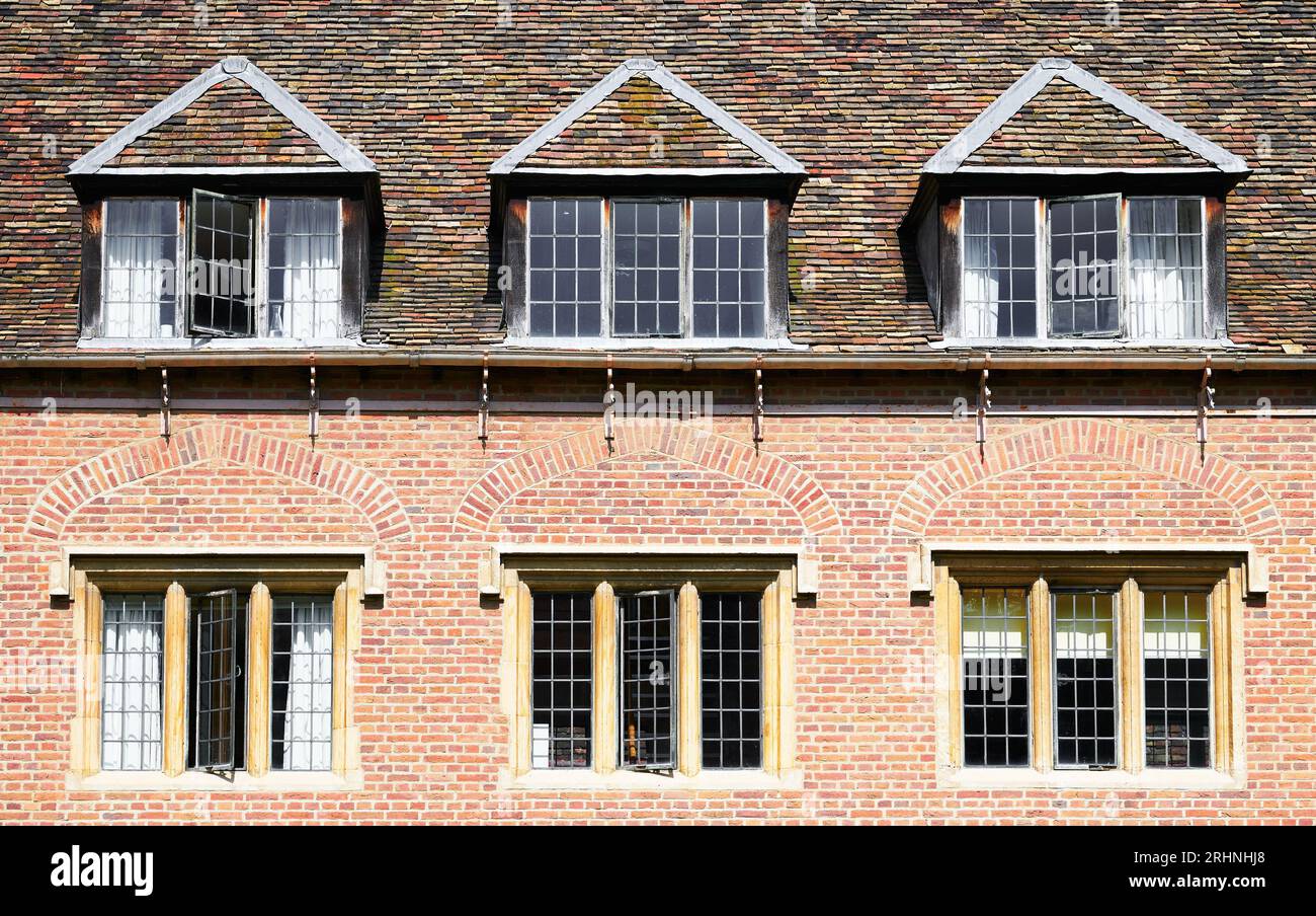A trio of windows at Pembroke College, founded in the 14th century ...