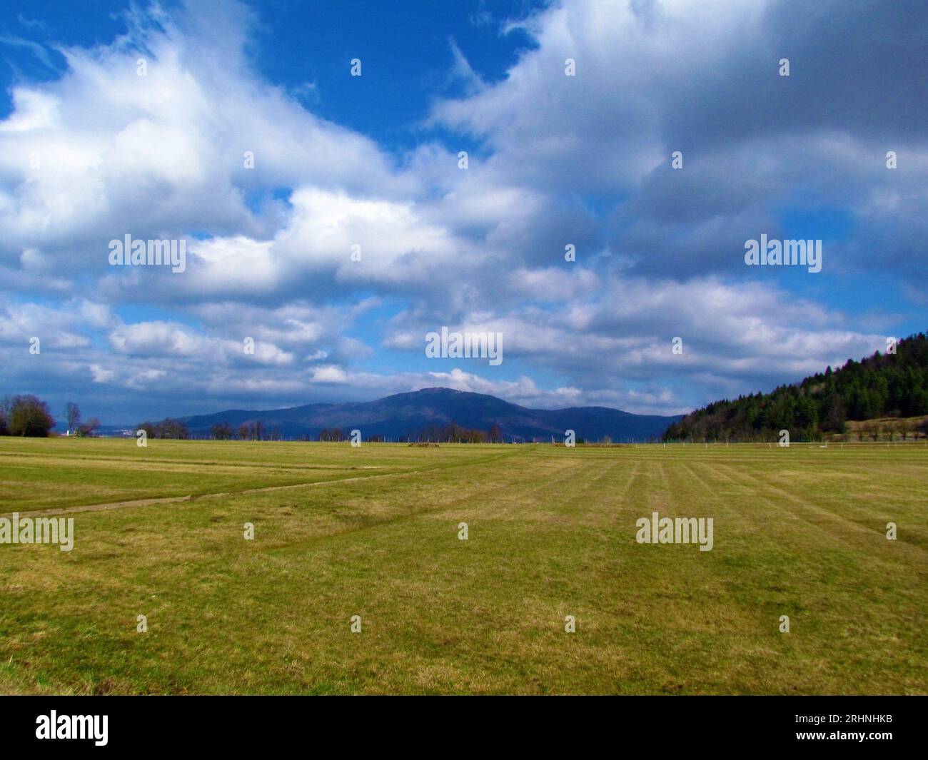 View of Slivnica hill in Notranjska, Slovenia and a field in front with ...
