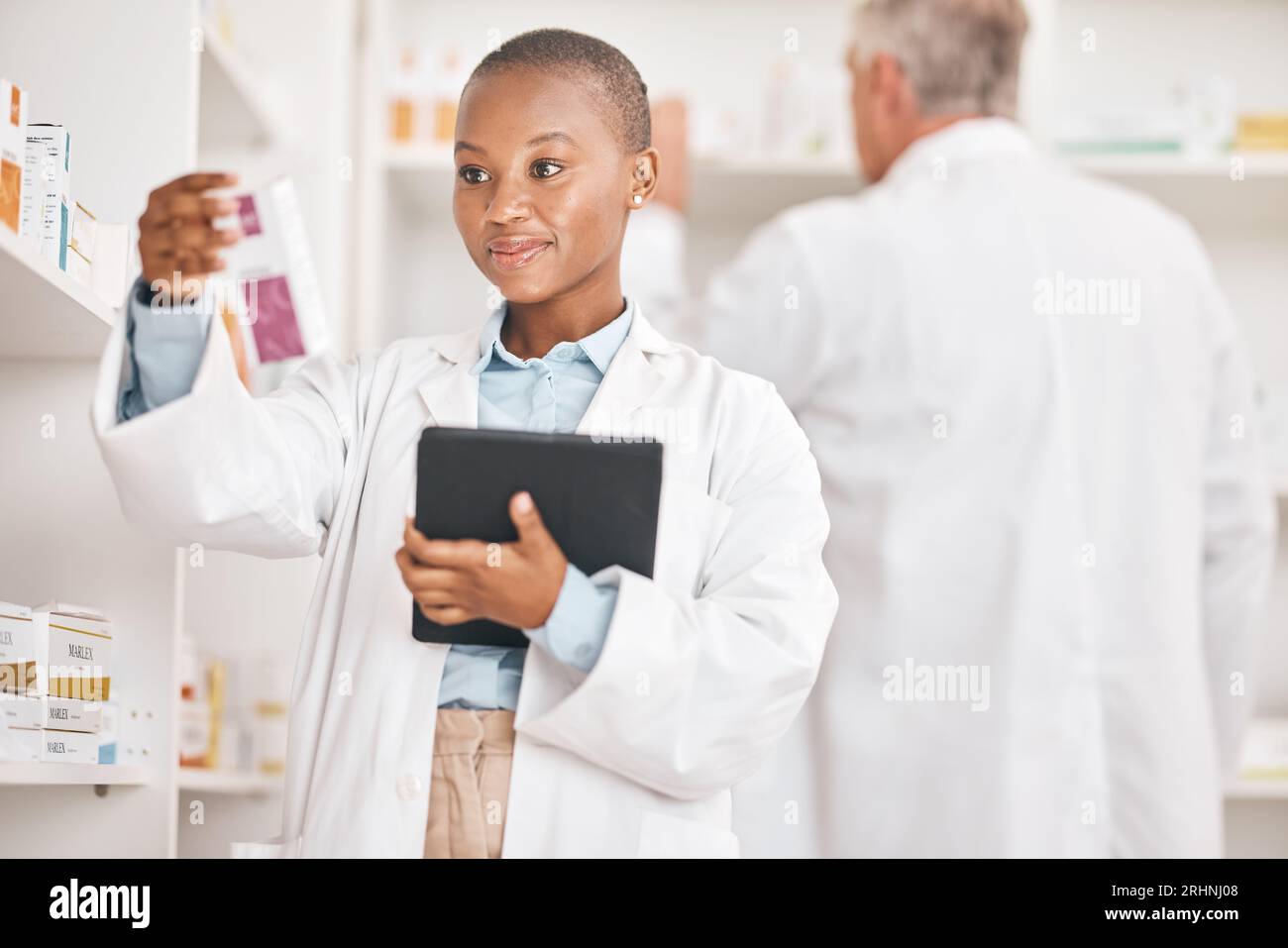 Healthcare, pharmacist and black woman with a tablet, pill box and ...