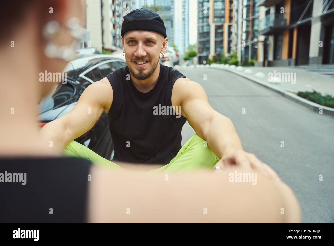 Young guys sit opposite each other Stock Photo - Alamy