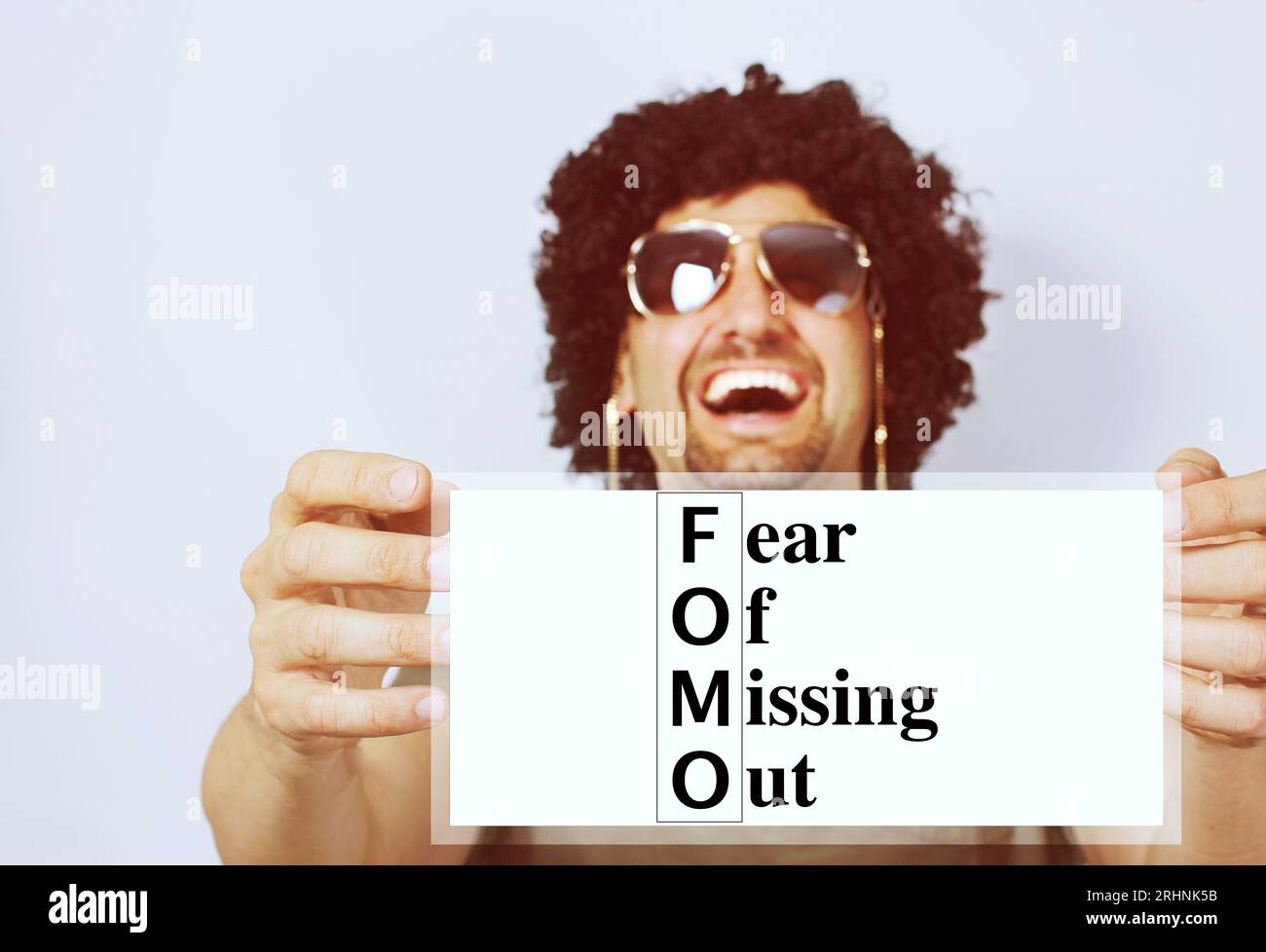 40's year old man enjoying their life with the sign FOMO : fear of ...